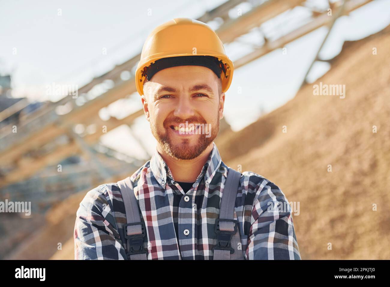 Positive man. Construction worker in uniform is on the quarry Stock ...