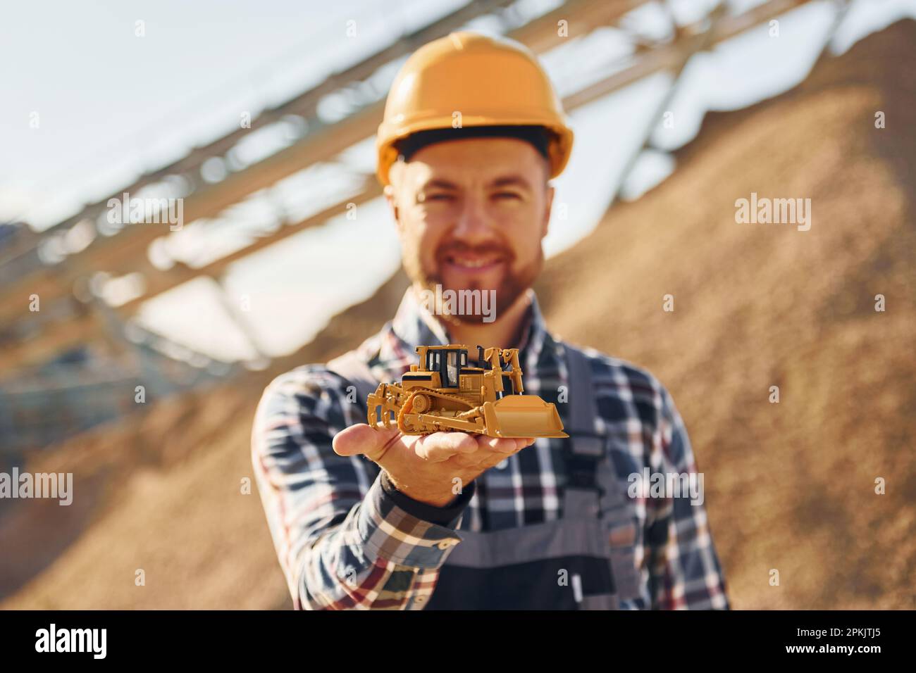 Positive man. Construction worker in uniform is on the quarry Stock ...