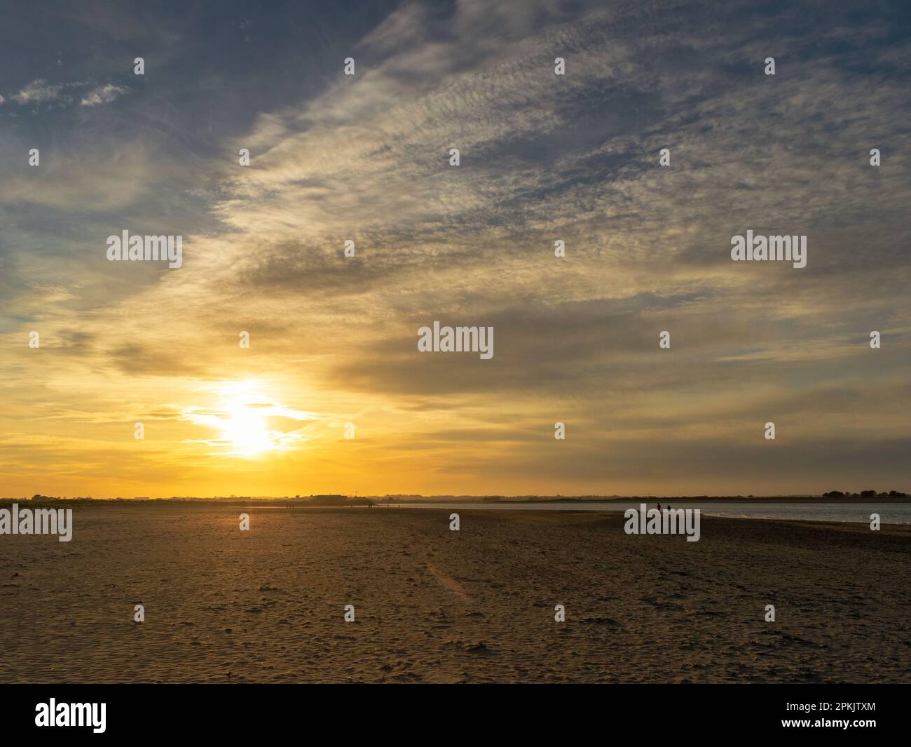 Hazy sunset sky at Burrow Beach Stock Photo - Alamy