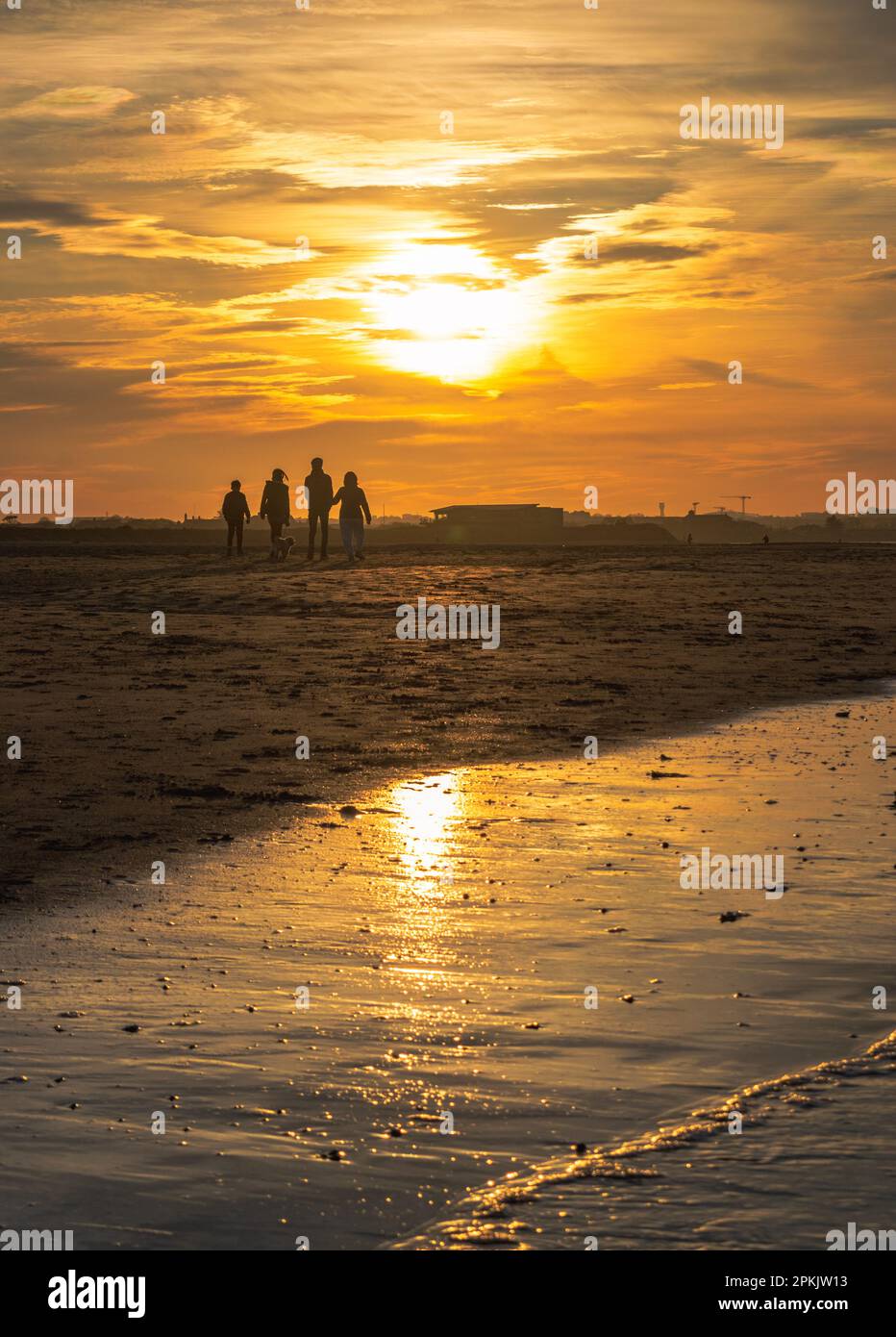 Golden hour silhouettes at Burrow Beach Stock Photo - Alamy