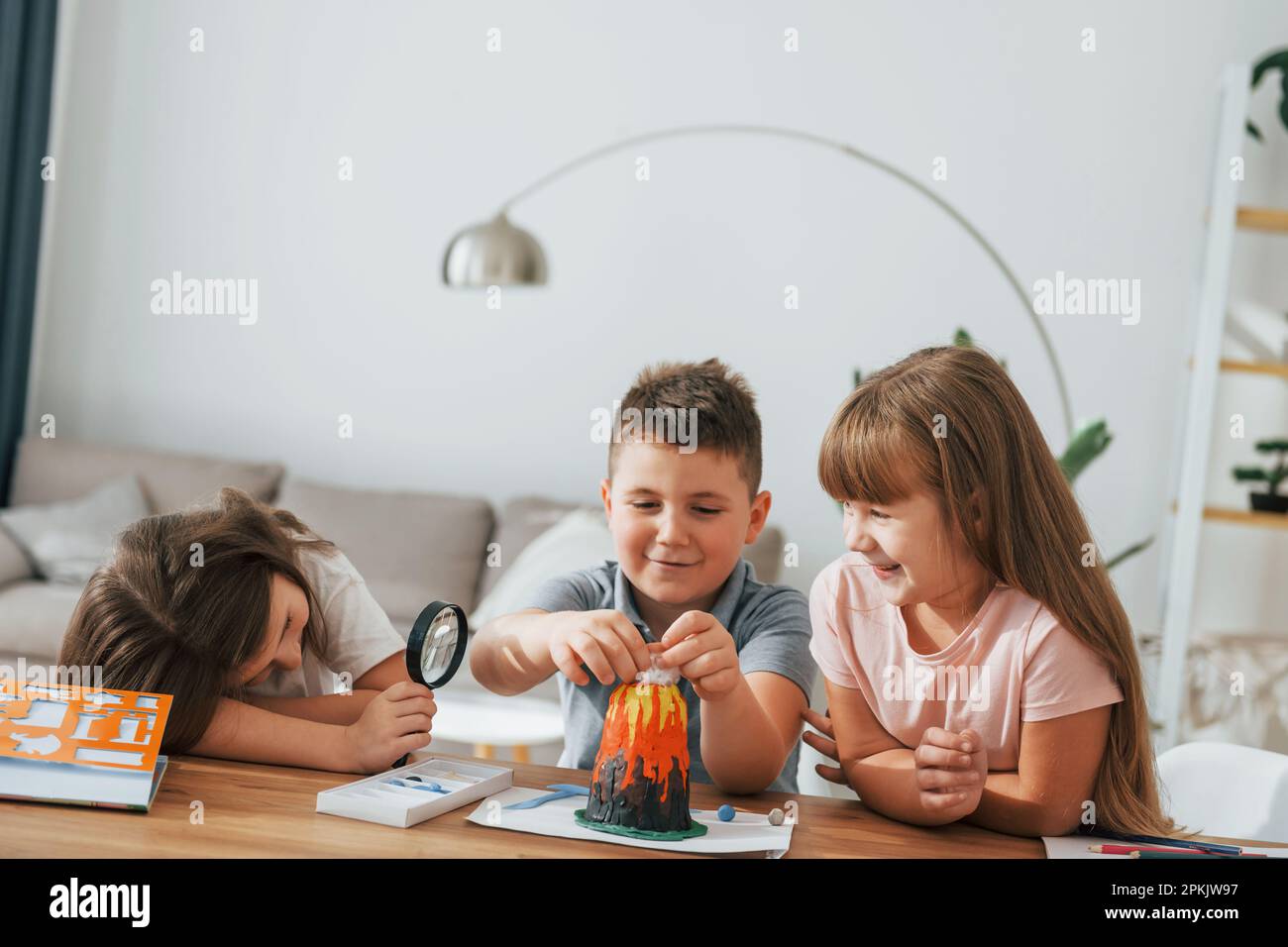 Working on the volcano project. Kids having fun in the domestic room at ...