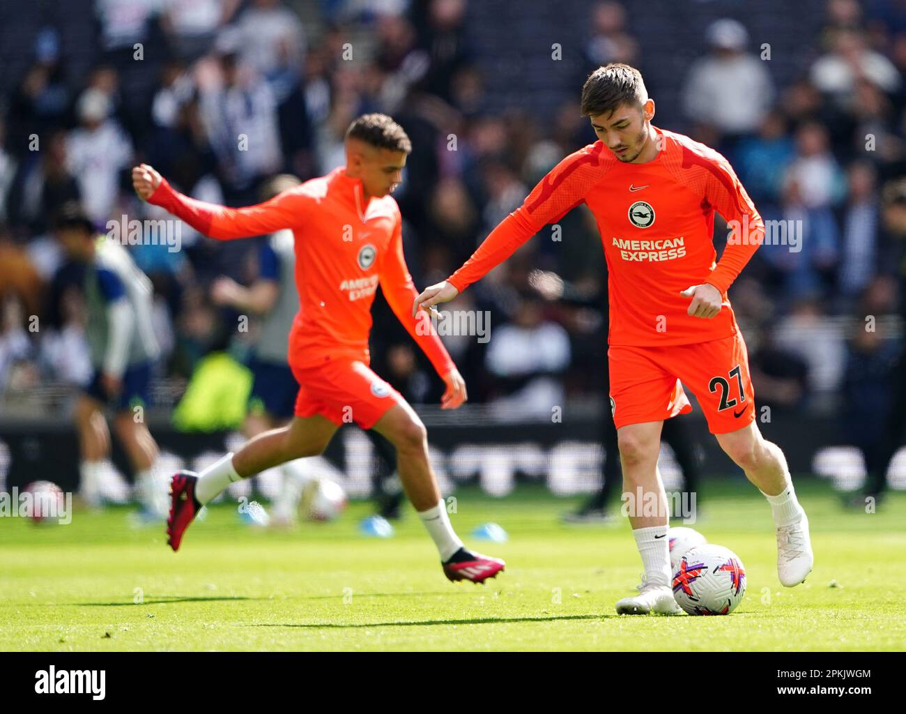 Brighton and Hove Albion's Billy Gilmour (right) warming up ahead of ...