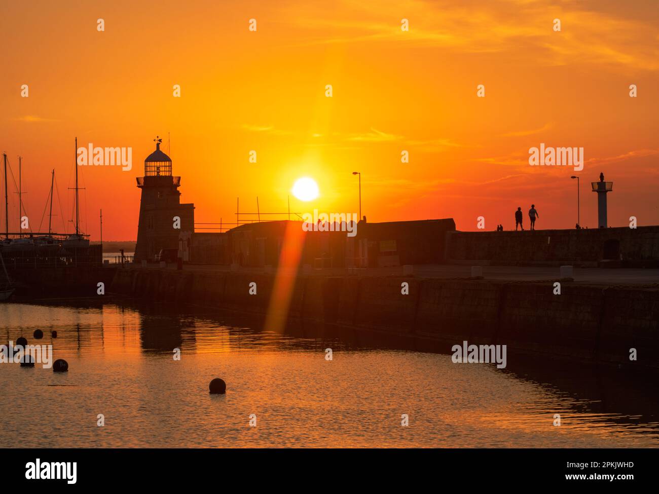 Golden hour sunset at Howth East Pier Stock Photo - Alamy