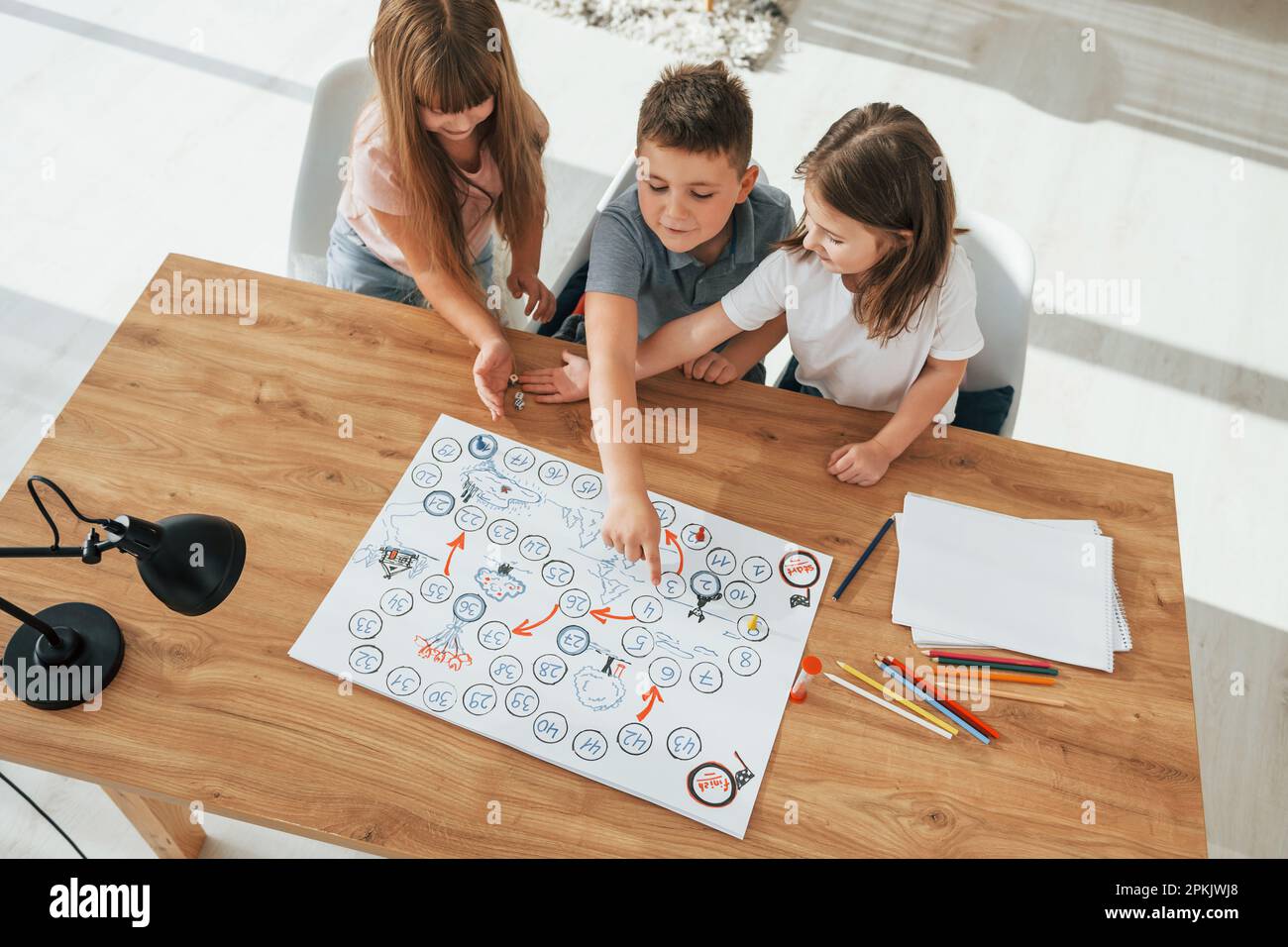 Step by step game. Kids having fun in the domestic room at daytime ...