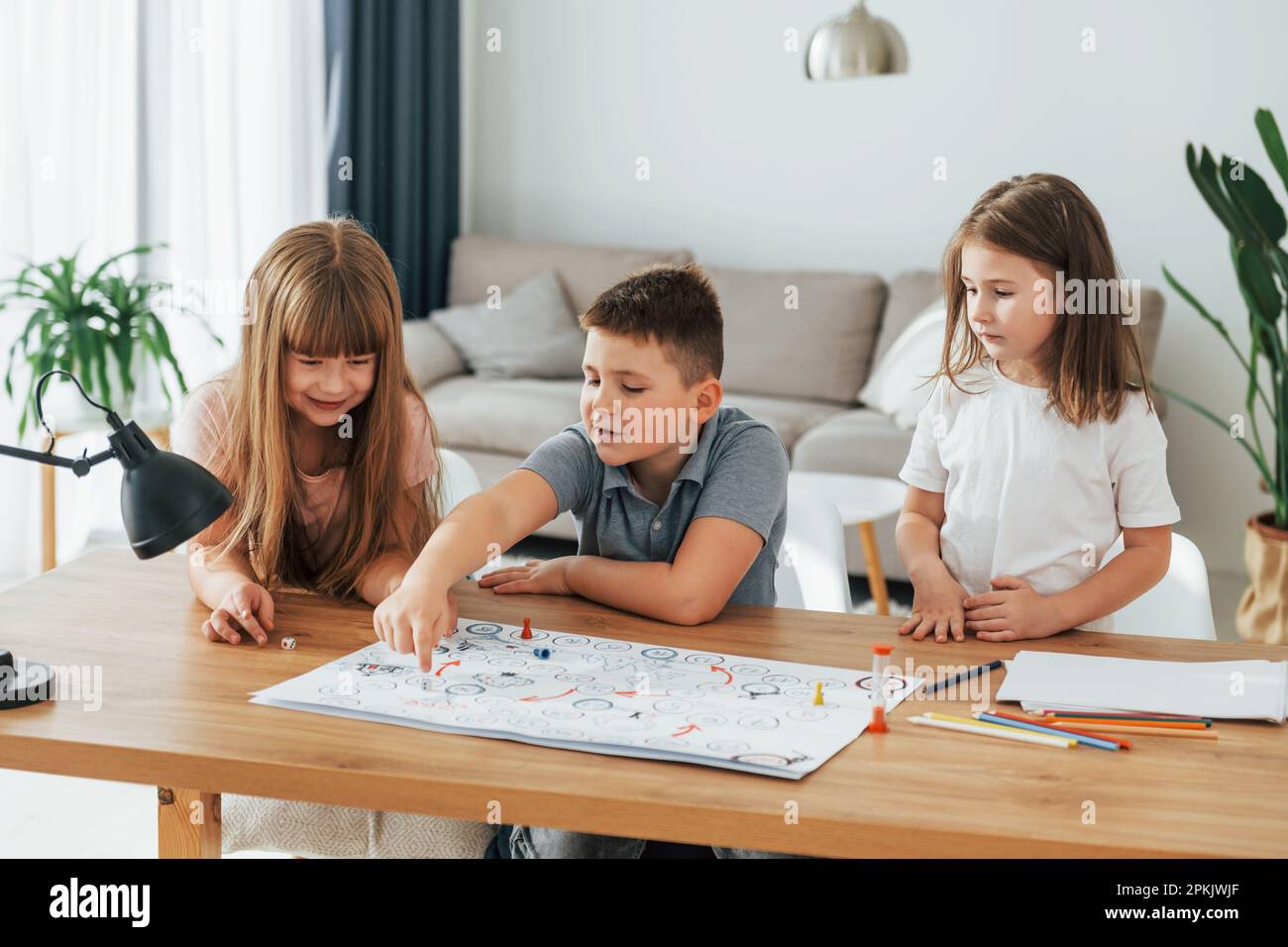 Step by step game. Kids having fun in the domestic room at daytime ...