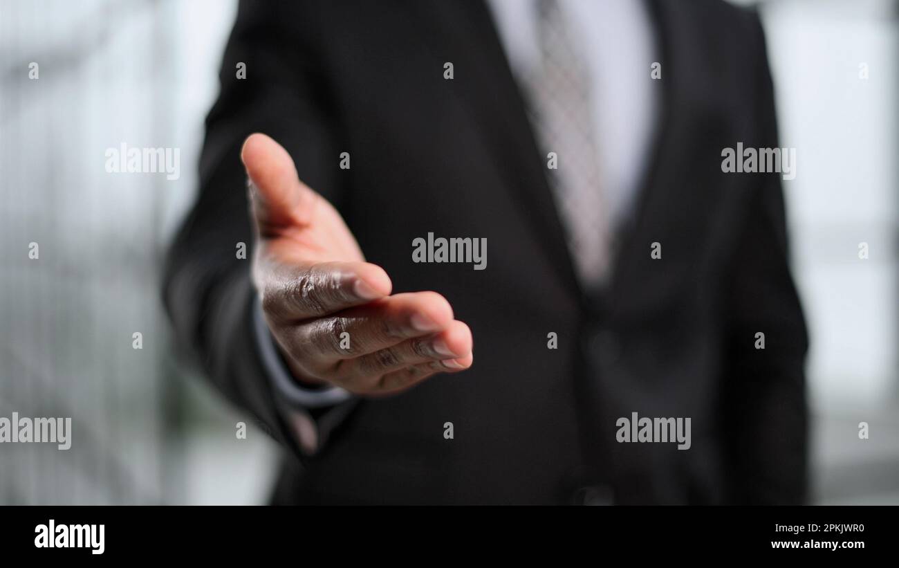 Close up crop image young businessman reaching out hand for shaking ...