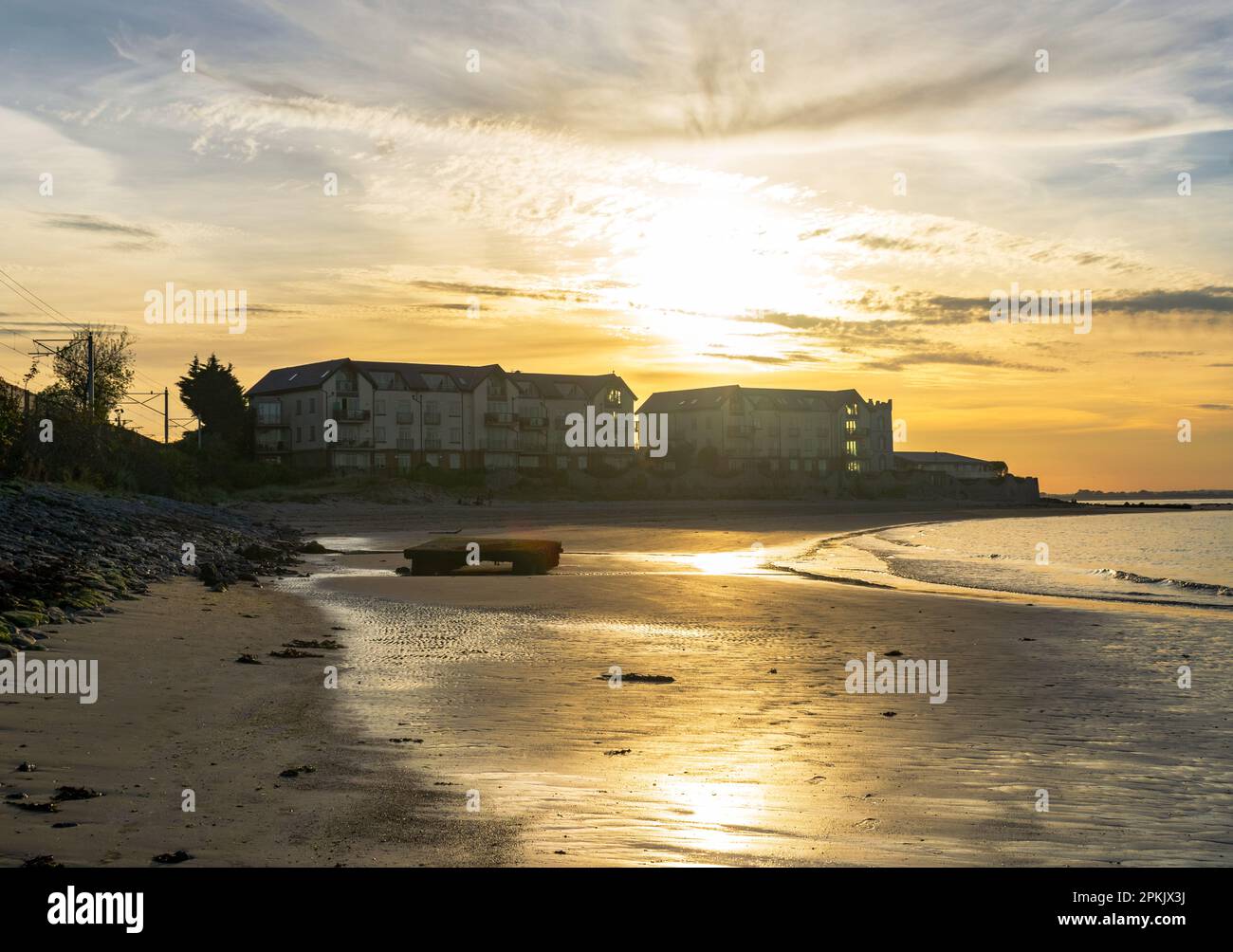 Hazy pre-sunset sky at Claremont Beach Stock Photo - Alamy