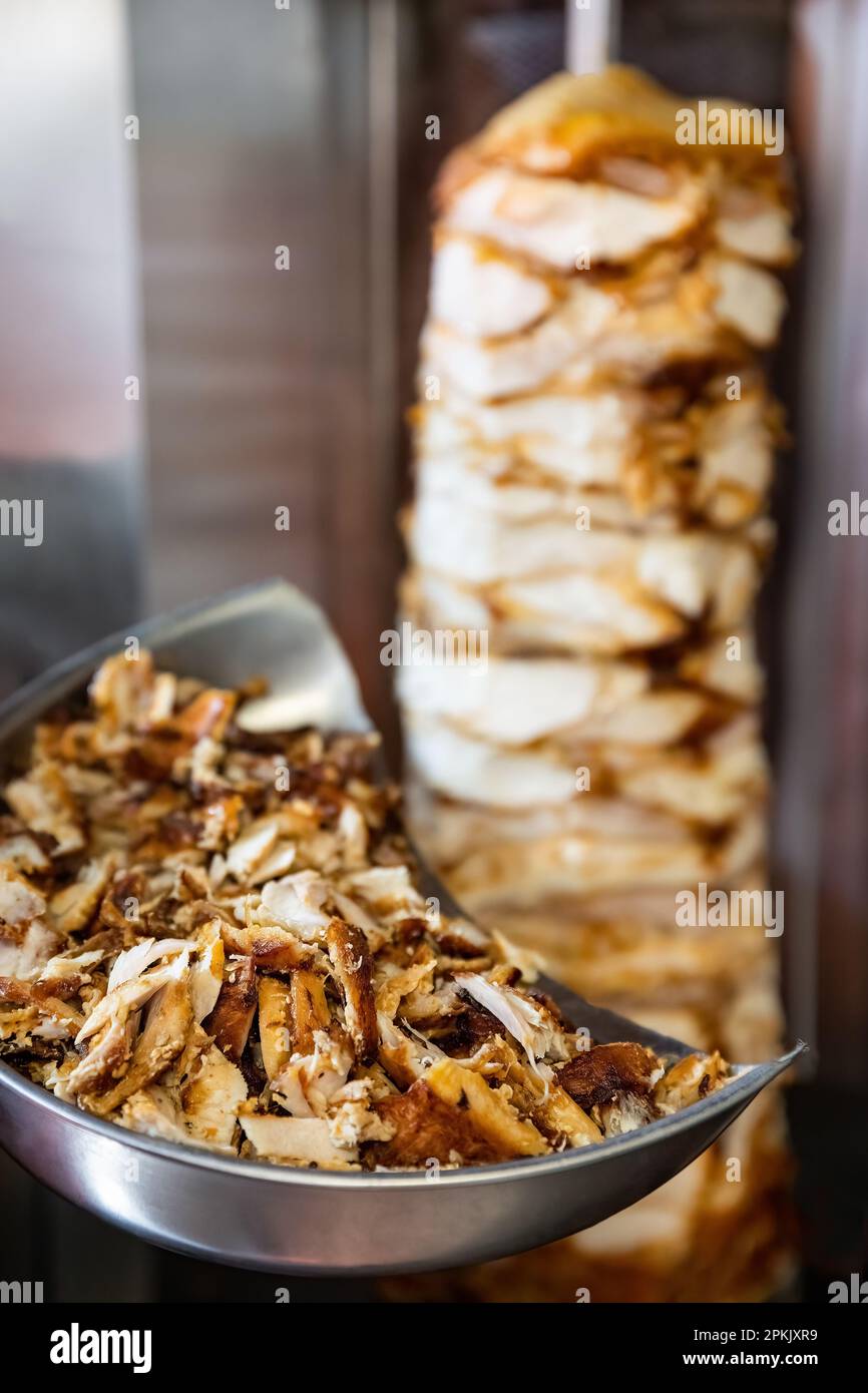 Juicy Greek traditional gyros grilled on fire and chopped for wrap ...