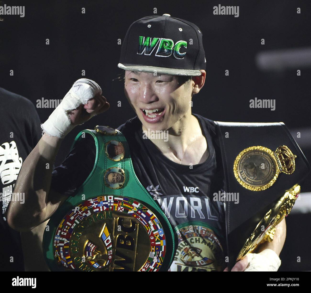 Japanese champion Kenshiro Teraji shows off the WBA and WBC champion belts after defeating ...