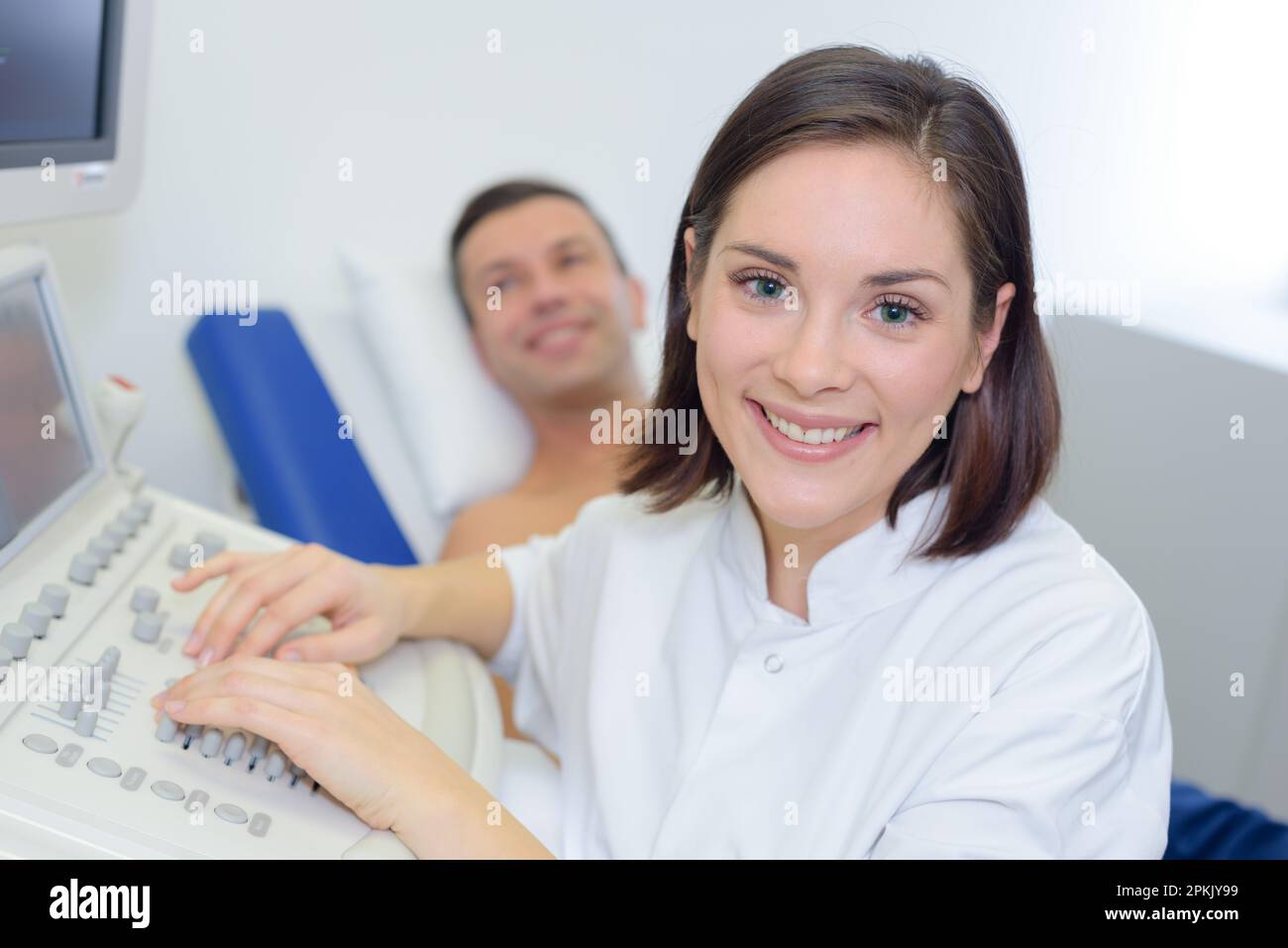 happy female doctor ready to screen male patient Stock Photo - Alamy