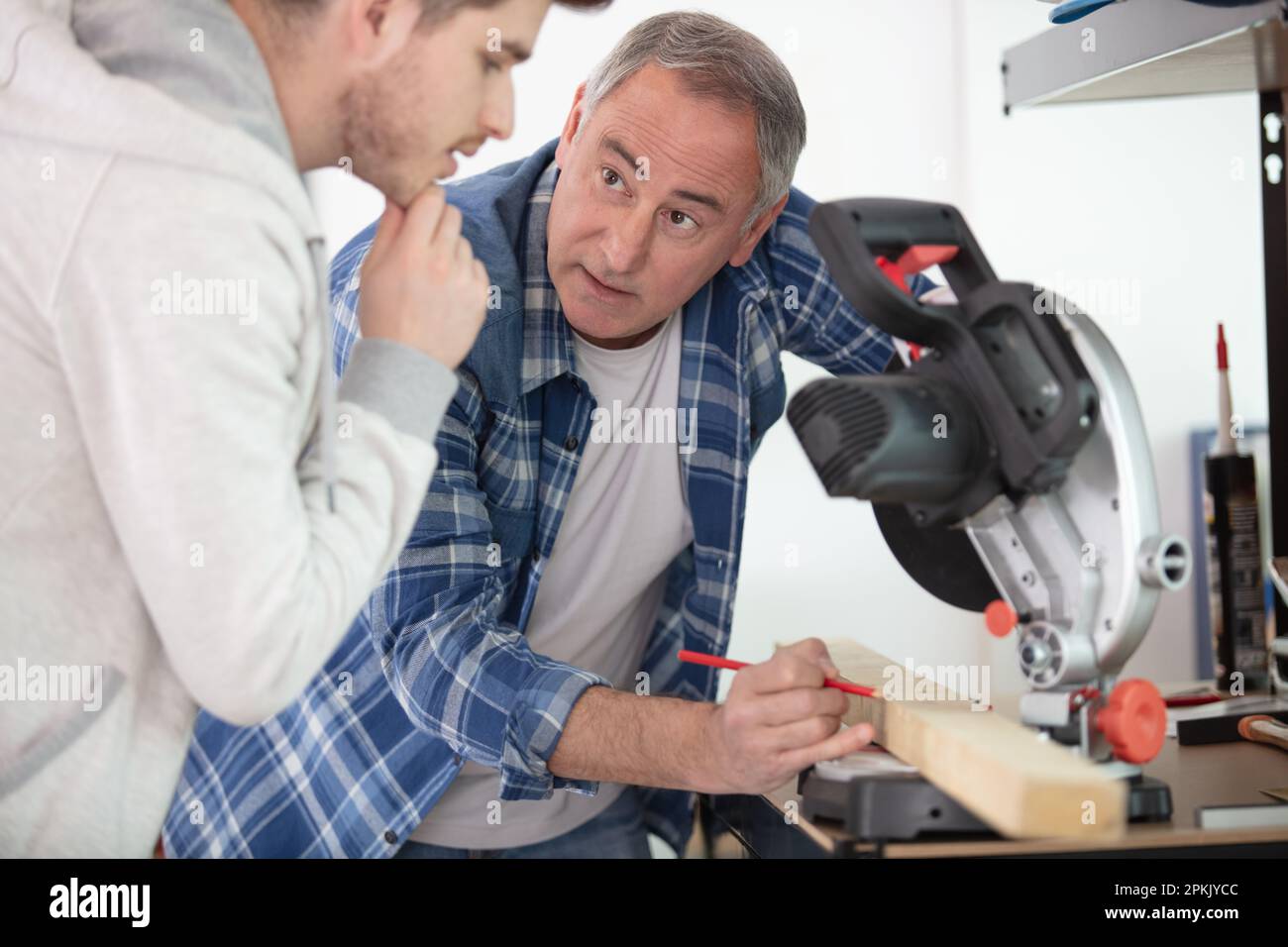 student in carpentry class using circular saw Stock Photo - Alamy