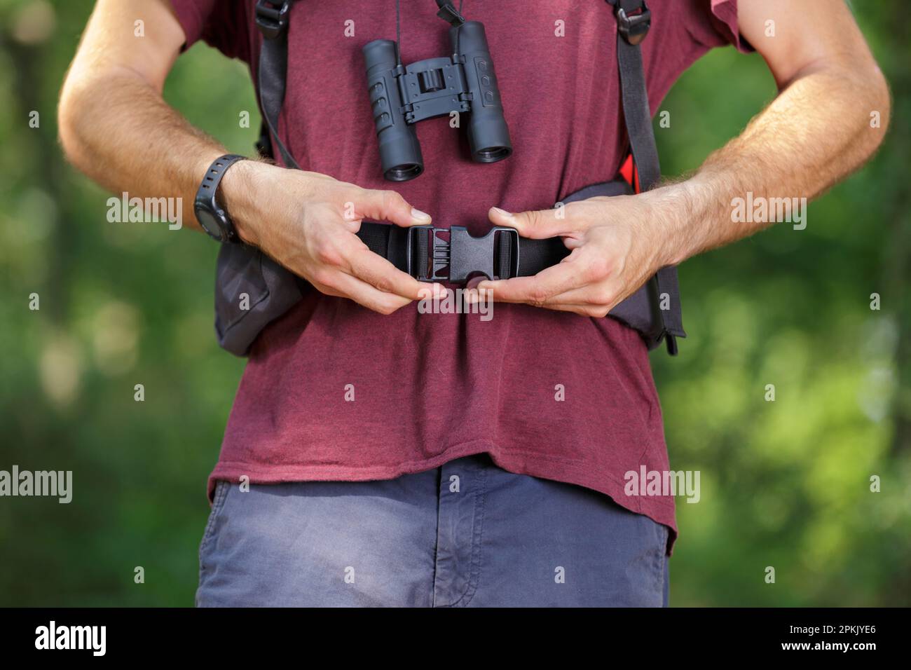 a man putting his backpack Stock Photo - Alamy