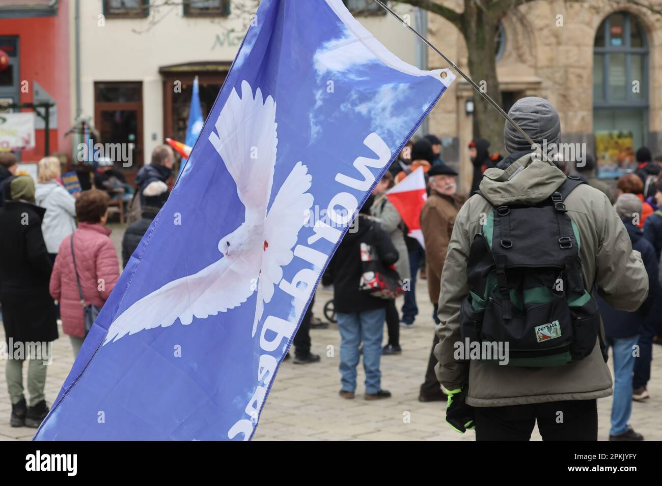 Jena, Germany. 08th Apr, 2023. A participant in an Easter march stands ...