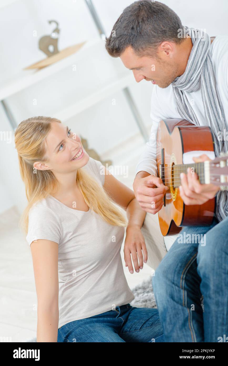 Man serenading woman hi-res stock photography and images - Alamy