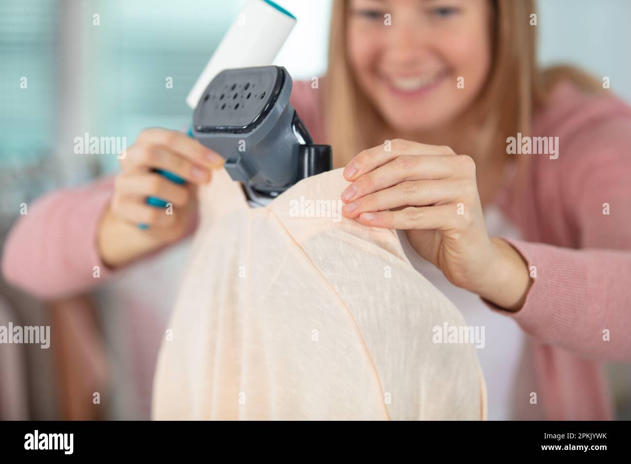 housewife changing the vacuum cleaner bag Stock Photo - Alamy