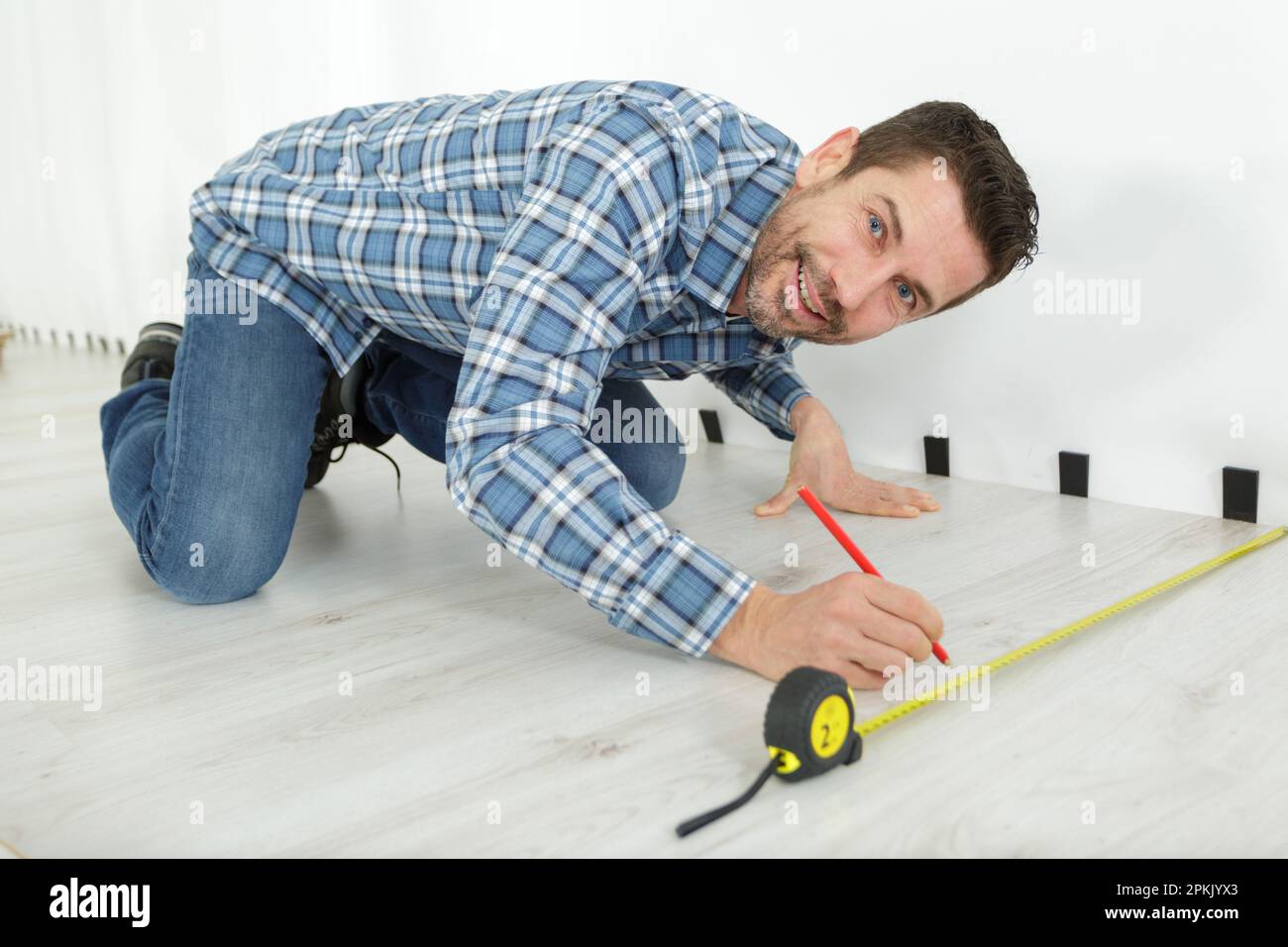 Construction man uses measuring hi-res stock photography and images - Alamy
