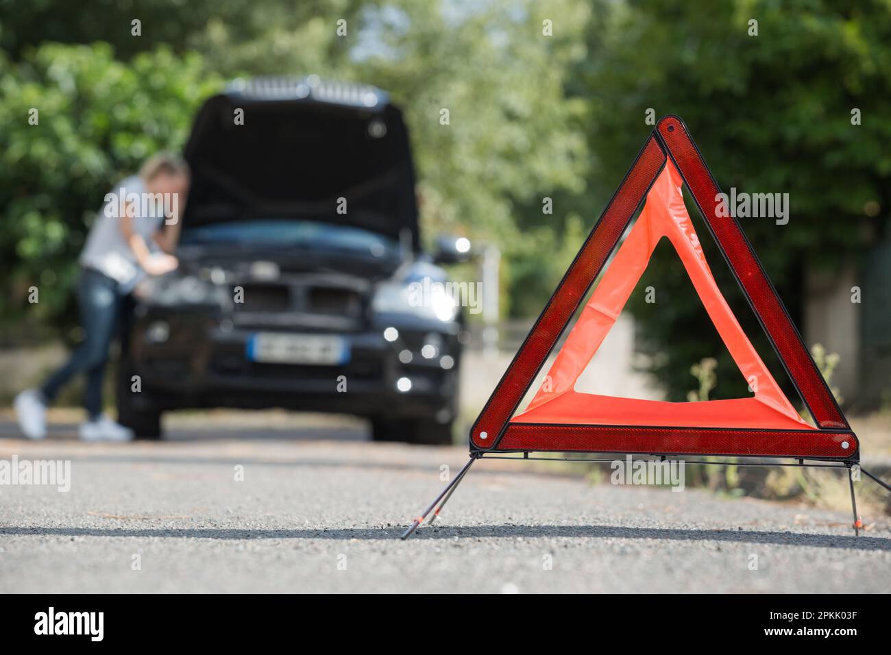 red triangle of a car on the road Stock Photo - Alamy