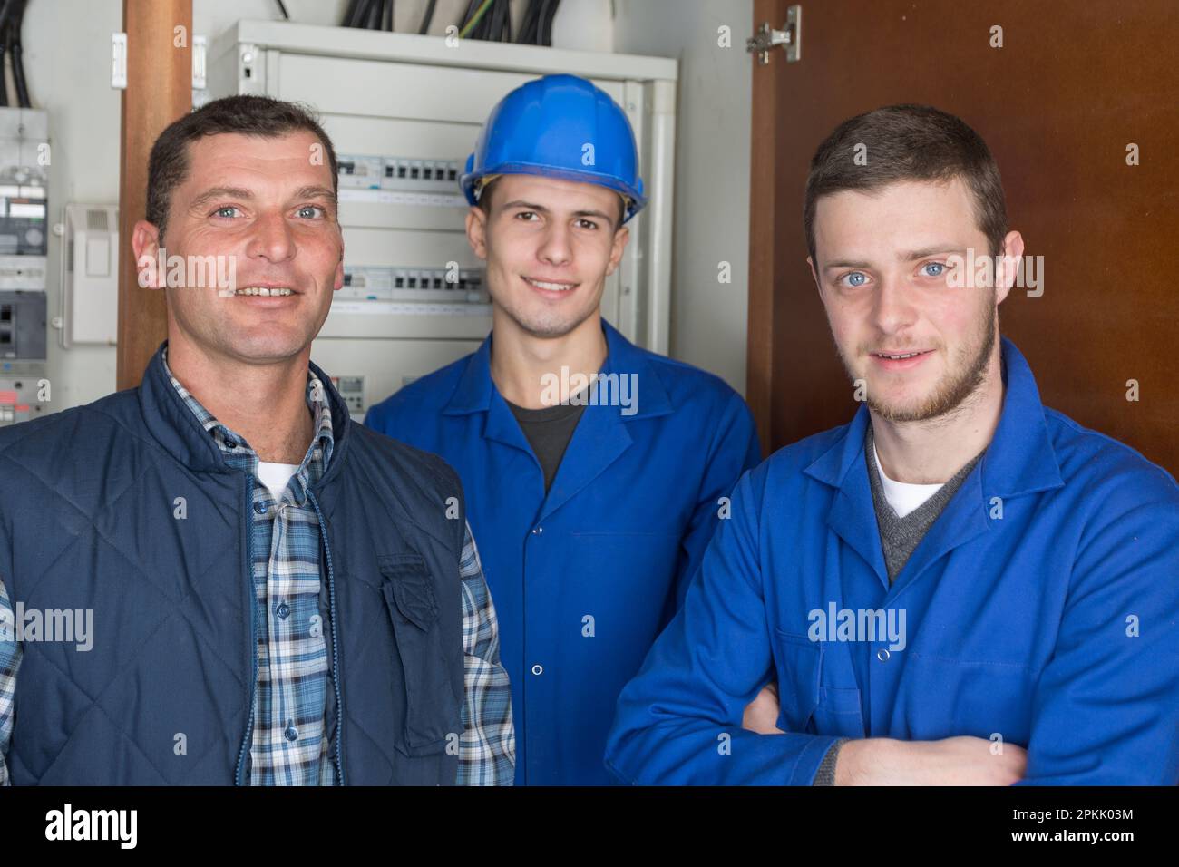 team of happy workers in uniform ready to work Stock Photo - Alamy