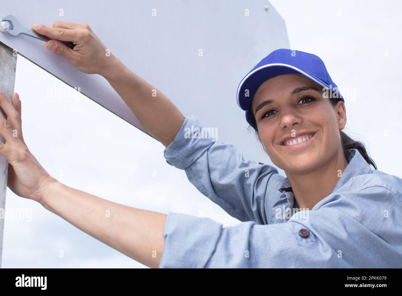 woman using spanner to tighten nut on a bolt Stock Photo - Alamy
