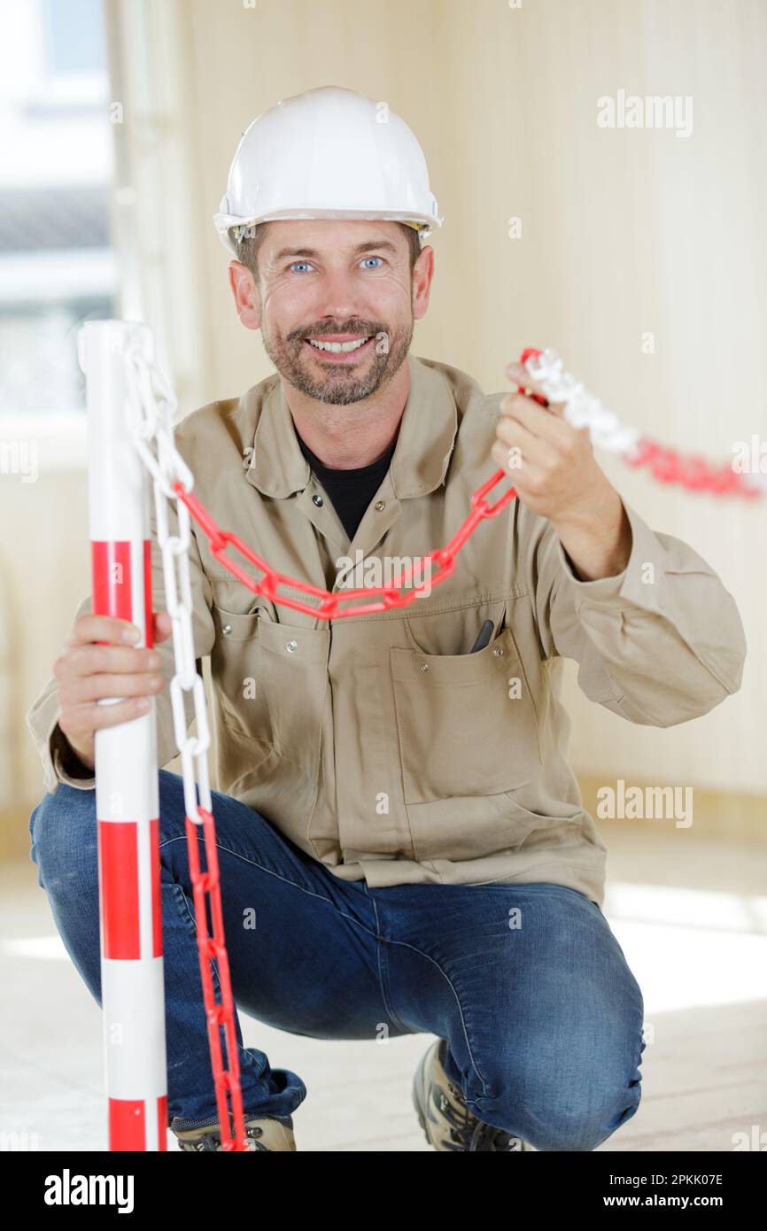 portrait of smiling builder wearing uniform Stock Photo - Alamy