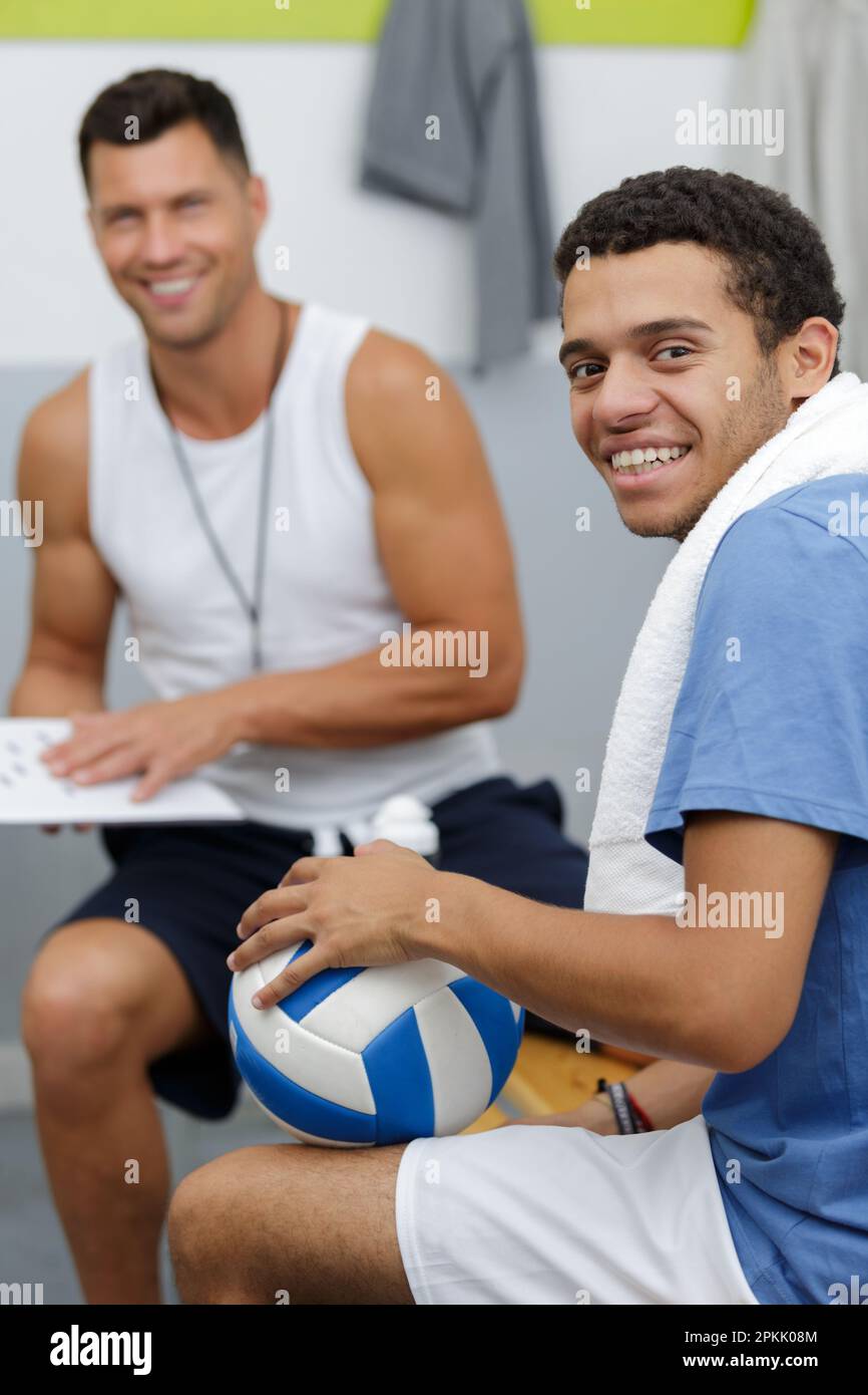 club coach and player smiling Stock Photo - Alamy