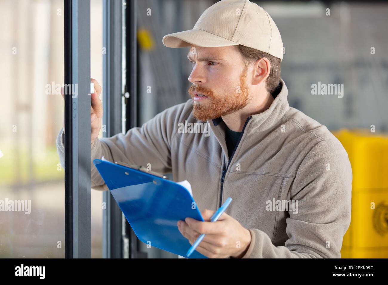 construction worker installing window in house Stock Photo - Alamy