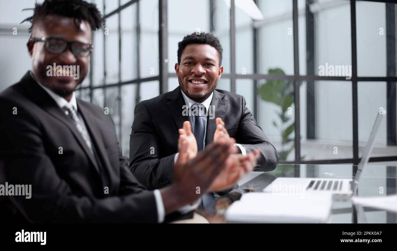 Middle aged businessman laptop clapping hi-res stock photography and ...