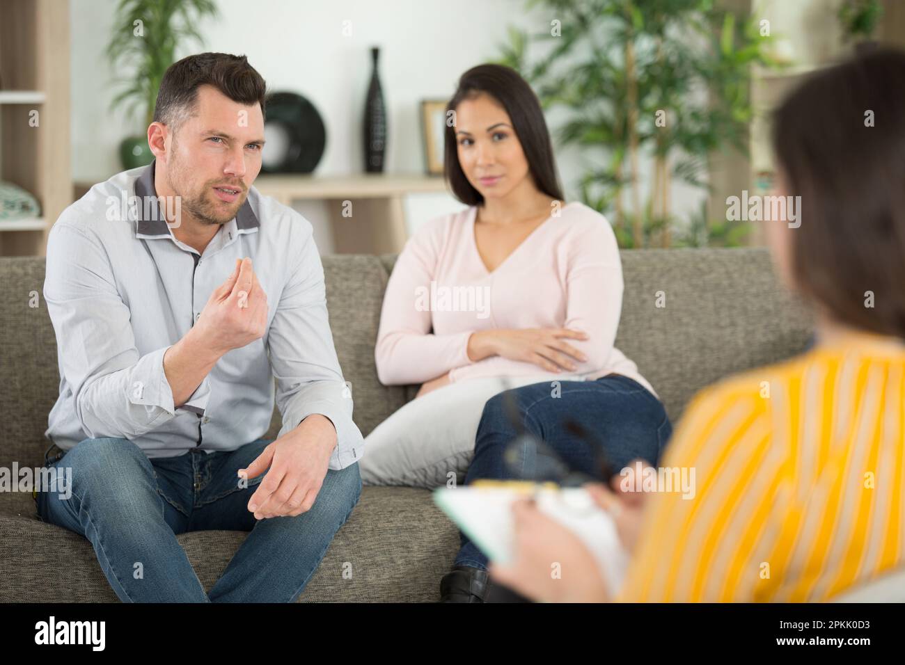 couple conversing with marriage guidance counsellor Stock Photo - Alamy