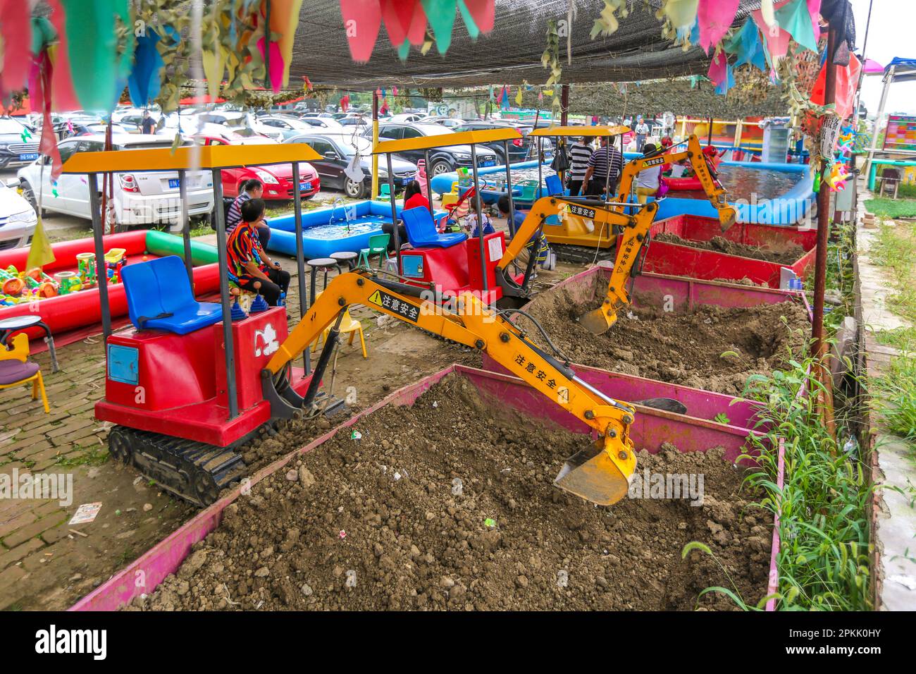 Children's playground with excavators that can dig sand in Beijing ...