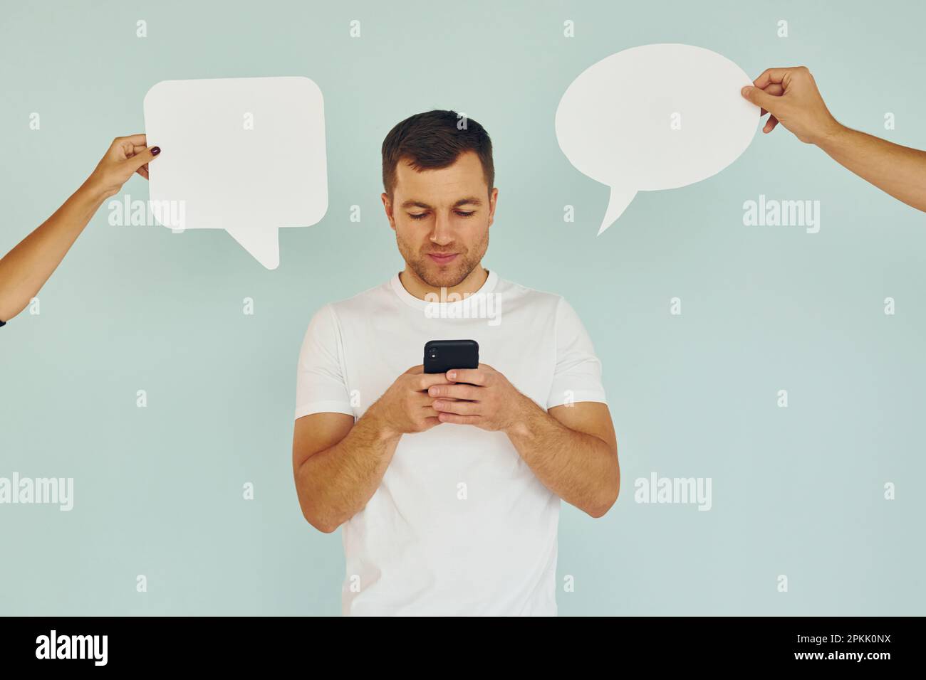 Conversation text. Man standing in the studio with empty signs Stock ...
