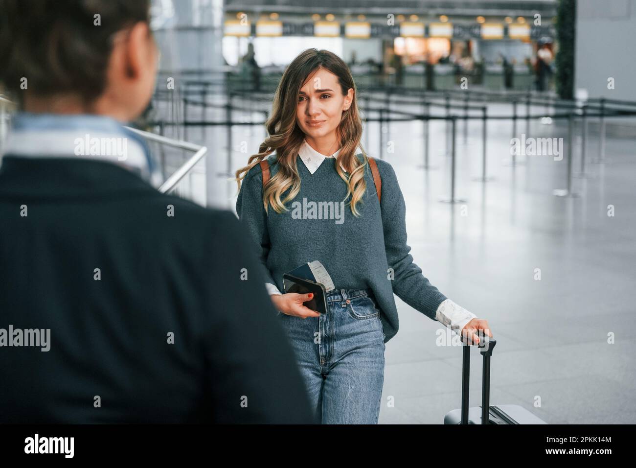 Pass procedure. Young female tourist is in the airport at daytime Stock ...