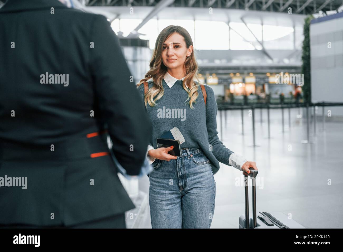 Pass procedure. Young female tourist is in the airport at daytime Stock ...