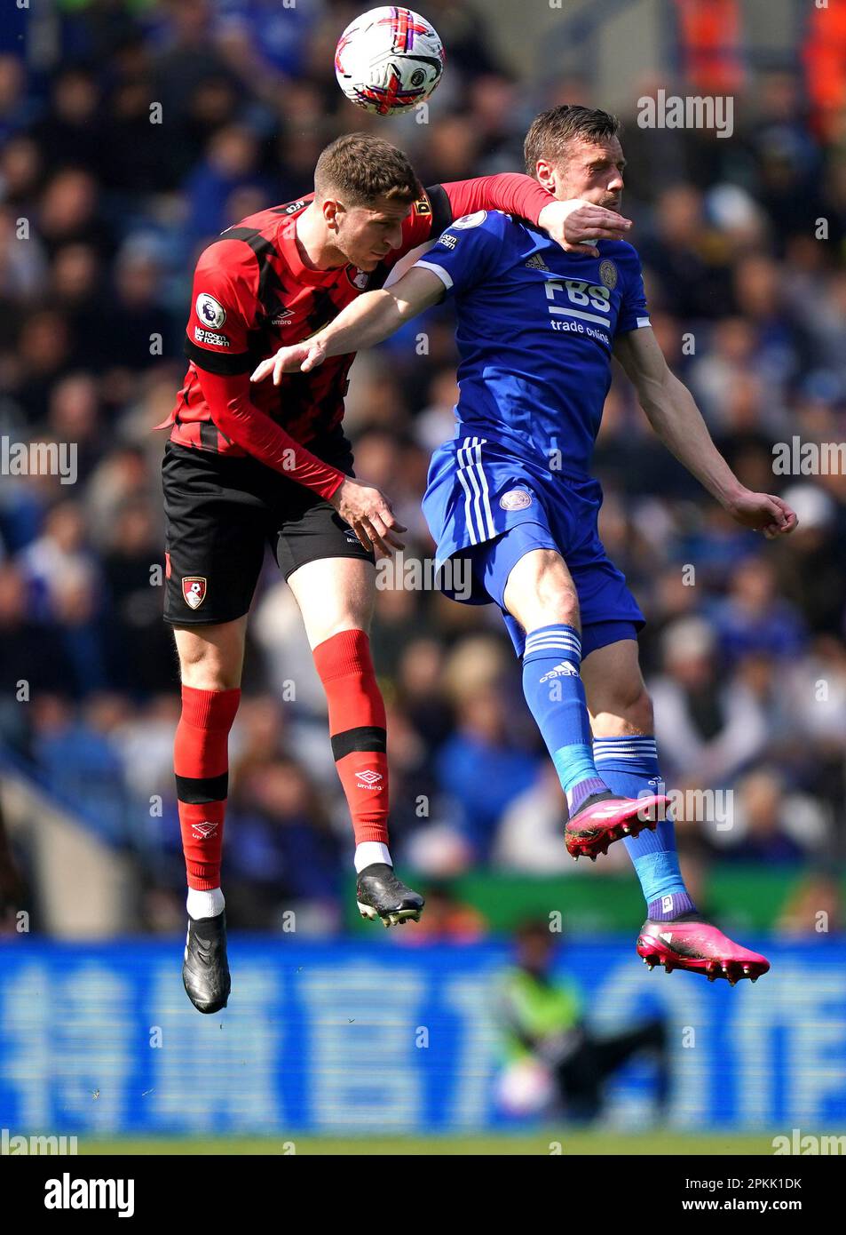 Bournemouth's Chris Mepham (left) and Leicester City's Jamie Vardy ...