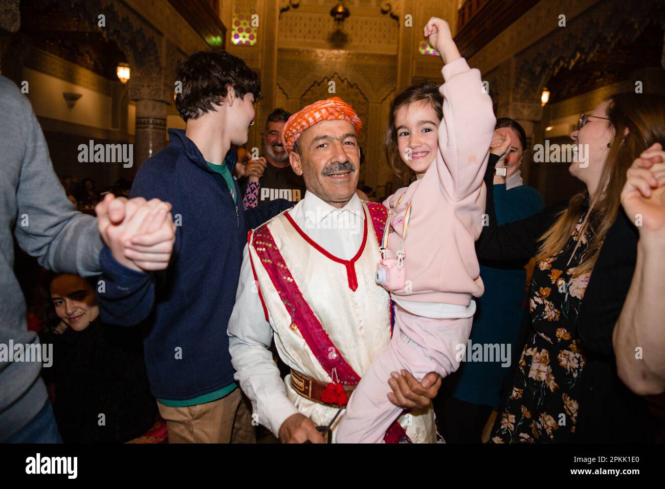 A performer dances with a young girl at Palais la Medina in Fez Morocco ...