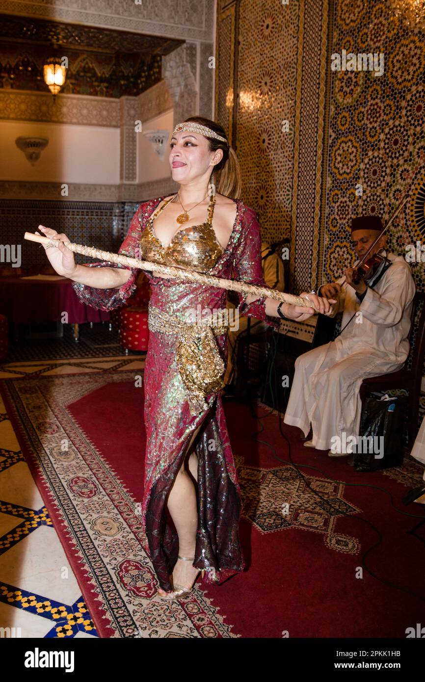 A belly dancer performs at Palais de Medina restaurant in Fez Morocco ...