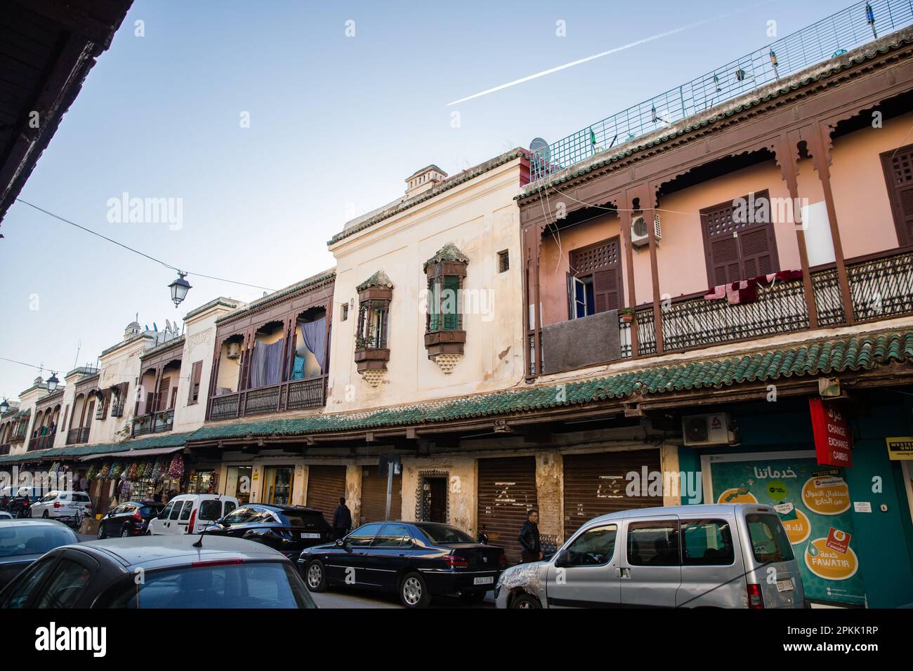 View of buildings with cars parked along a street in Fez Morocco Stock ...