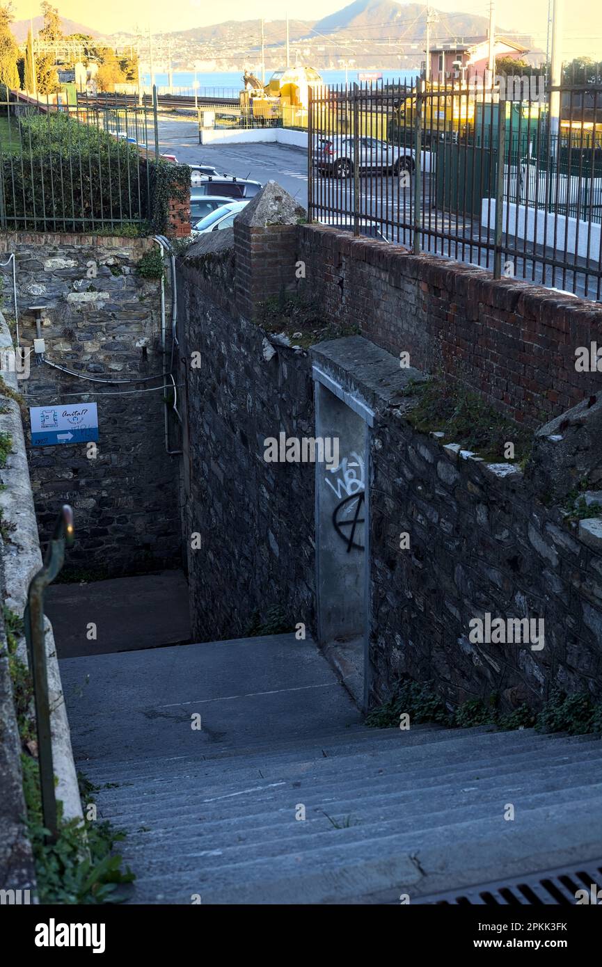 Staircase passageway next to a railroad at twilight Stock Photo - Alamy