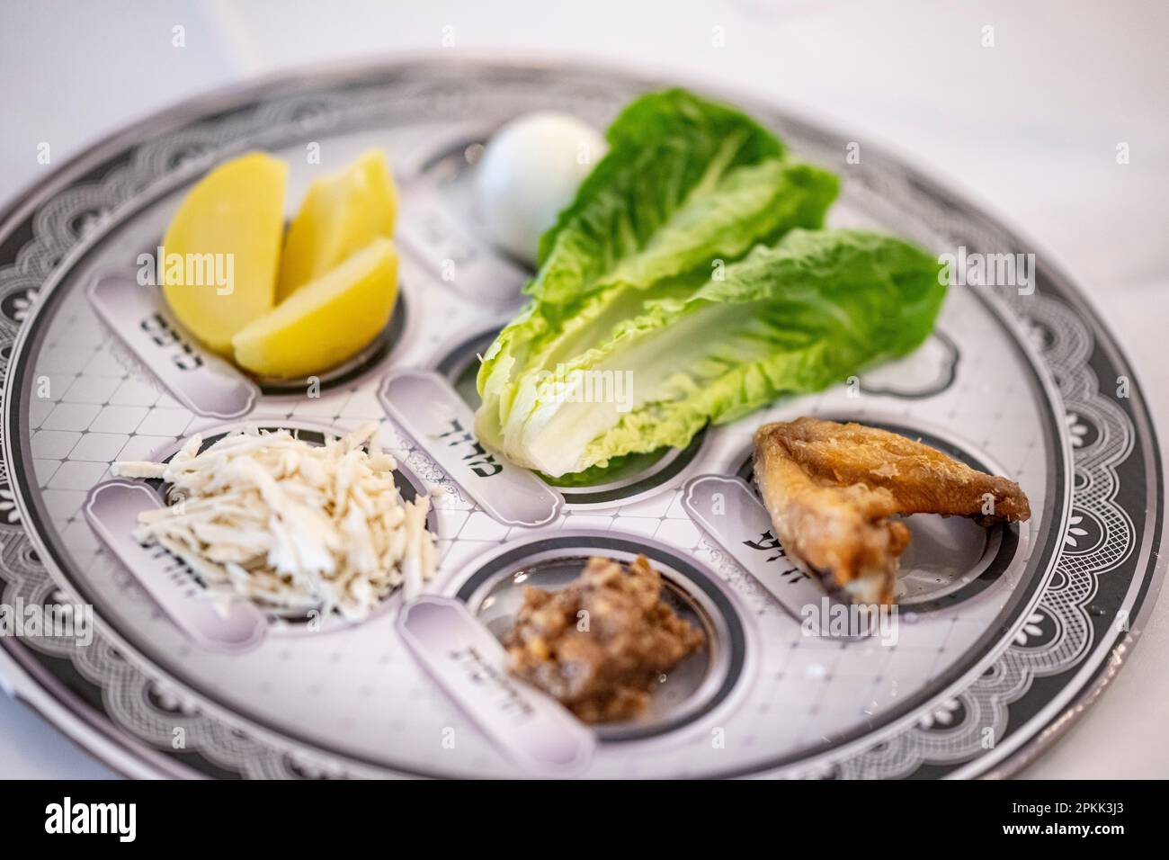 05 April 2023, Berlin: A Seder plate is on the table at Passover at the ...