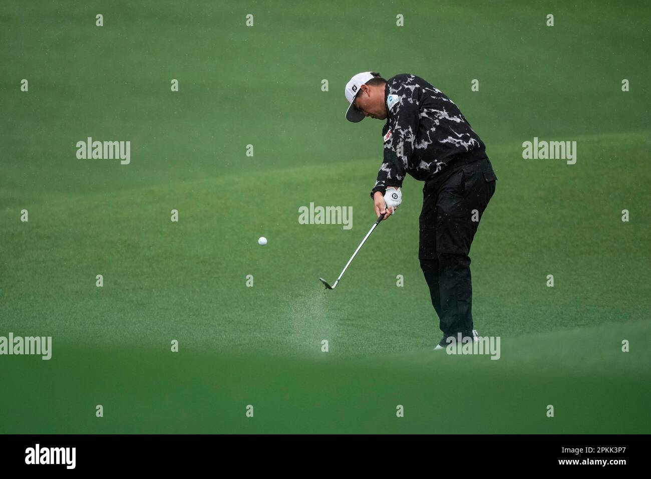 Sungjae Im, of South Korea, hits from the fairway on the 18th hole ...