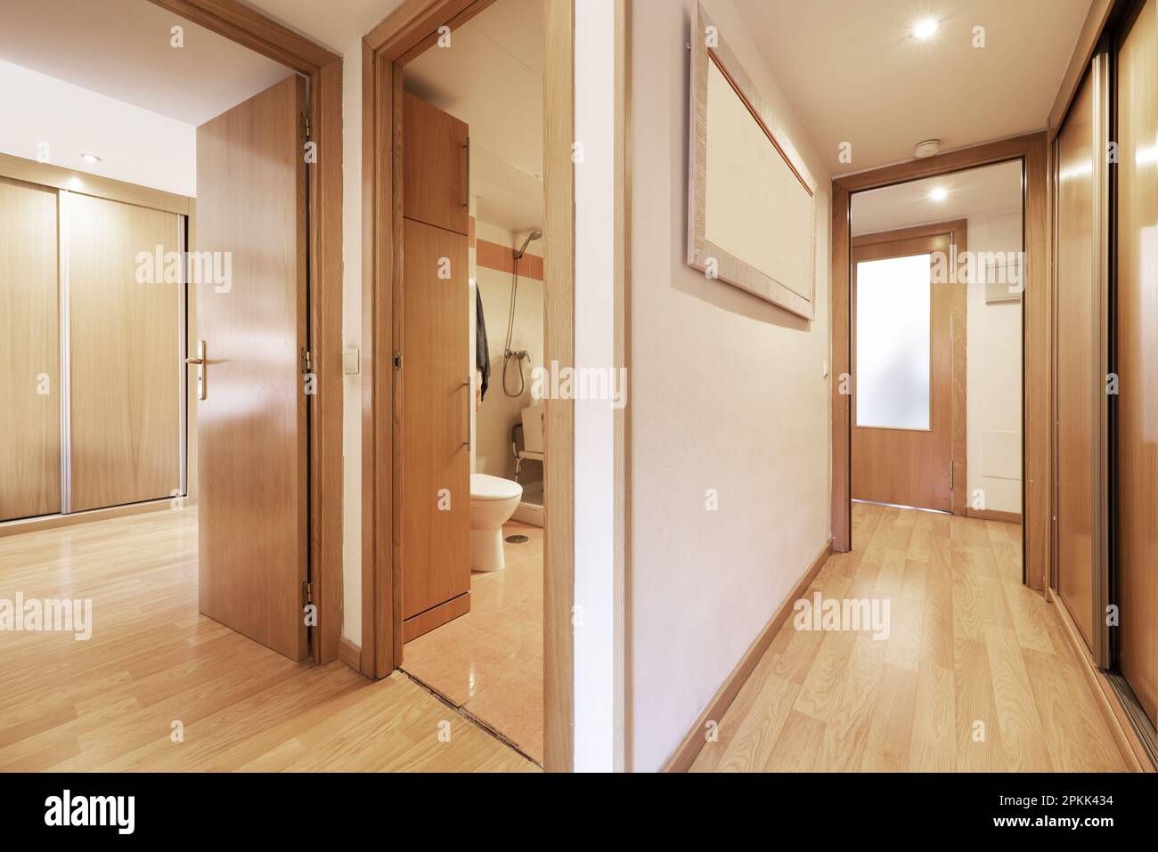 Corridors of a residential house with oak wooden doors and matching ...