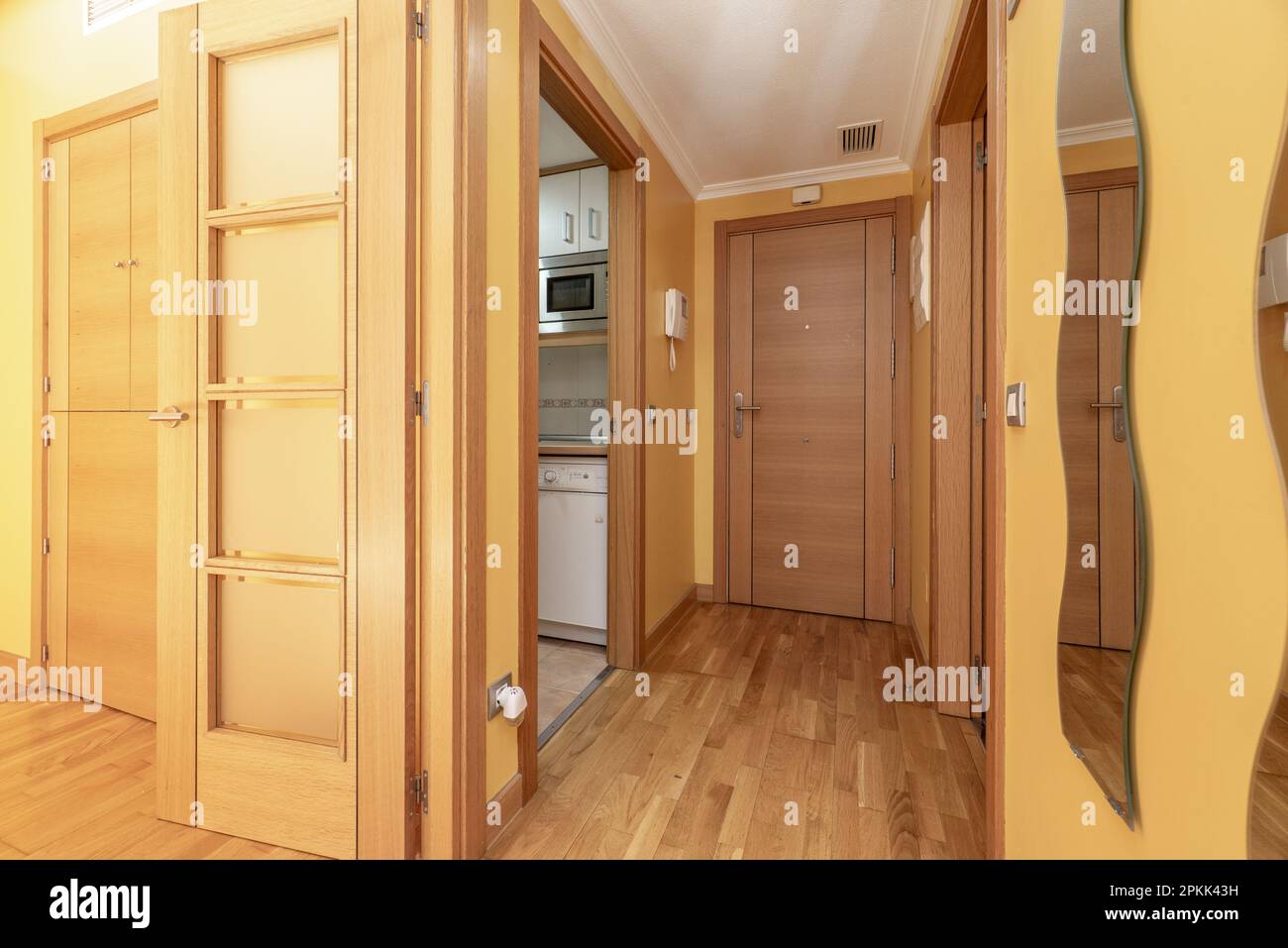 Entrance hall of a residential house with oak wooden doors, fitted ...