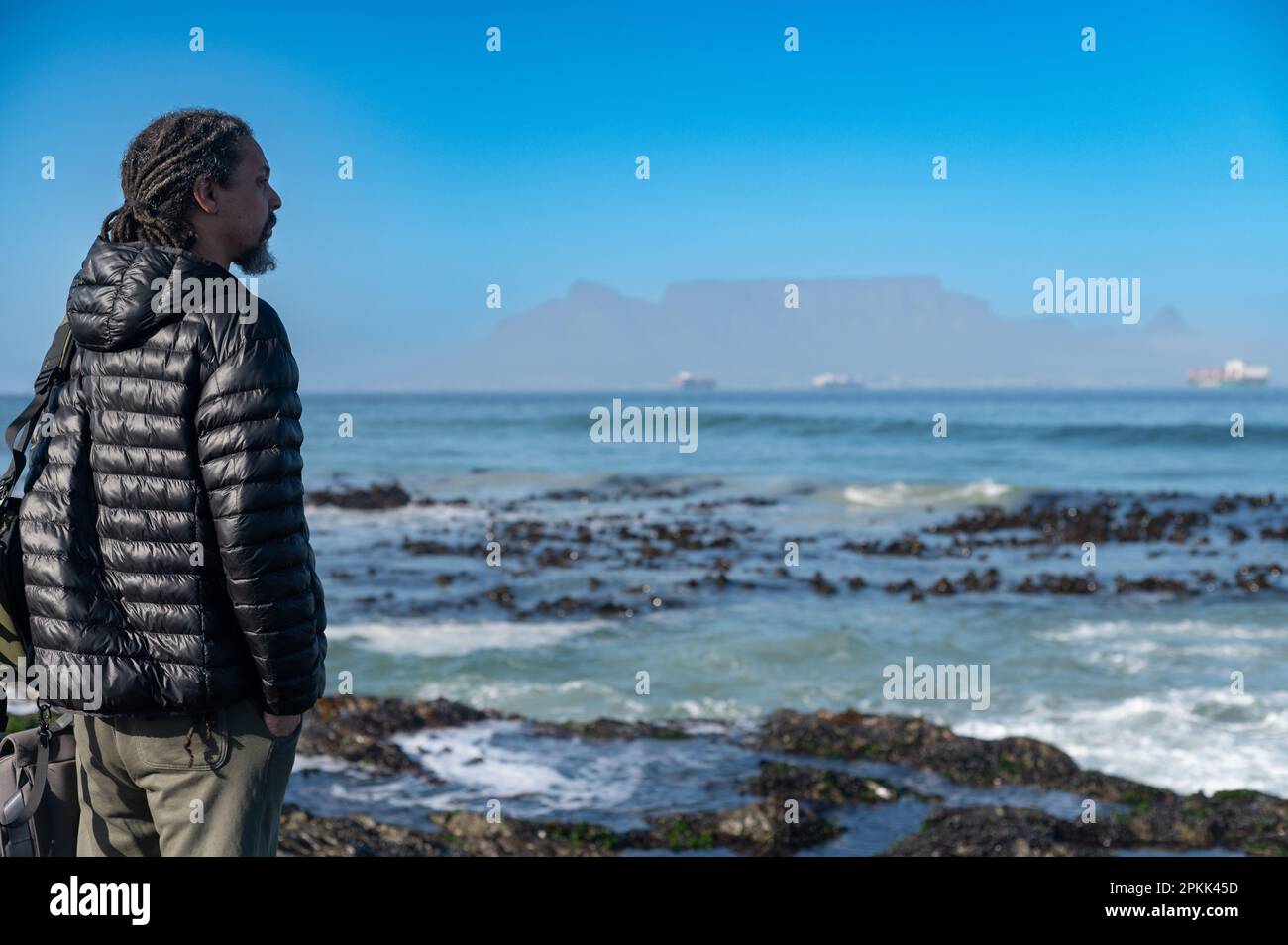 Portrait of man standing and contemplating Stock Photo - Alamy