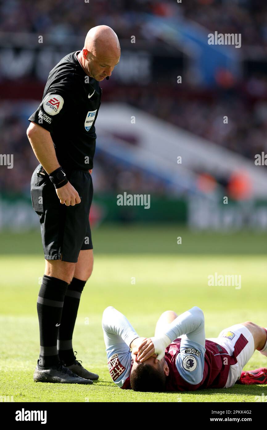 Aston Villa's Emiliano Buendia looks in pain after a challenge, as ... Aston Villa's Emiliano Buendia looks in pain after a challenge, as ...