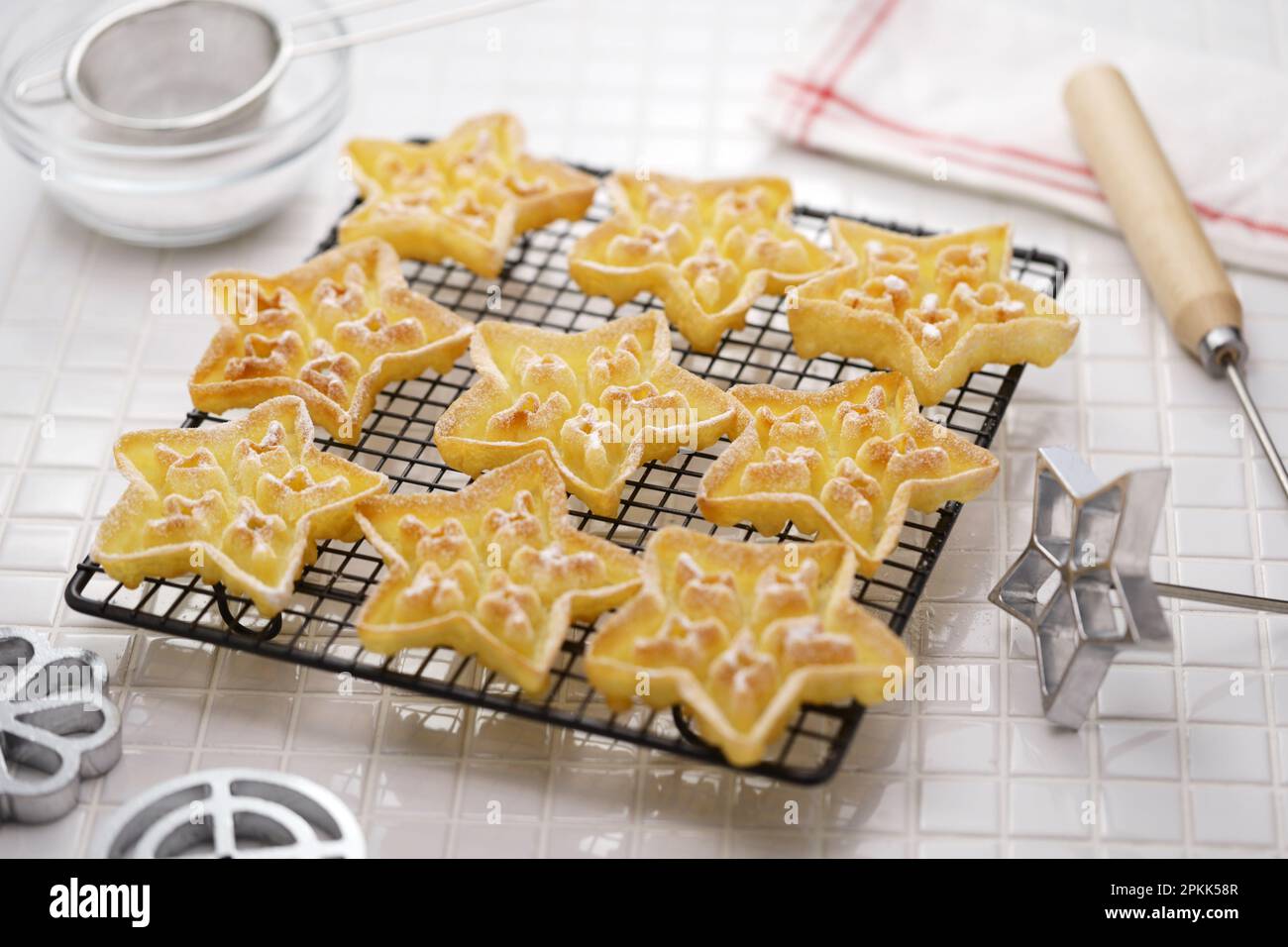 rosette cookies ( star ) on a cake cooling rack Stock Photo - Alamy