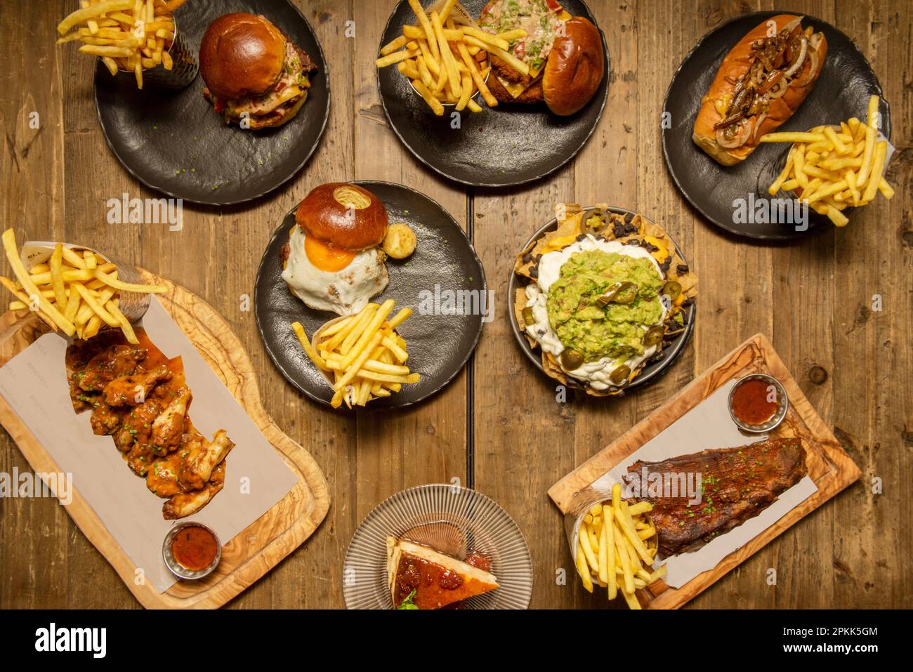 Set of fast food dishes with many burgers, bbq ribs, buffalo wings ...