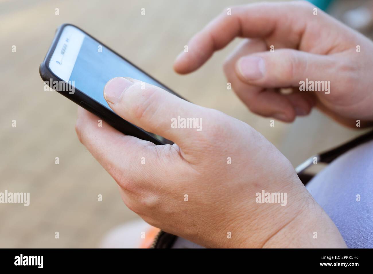 Close up of a man hands using mobile, scroll smart phone screen Stock ...