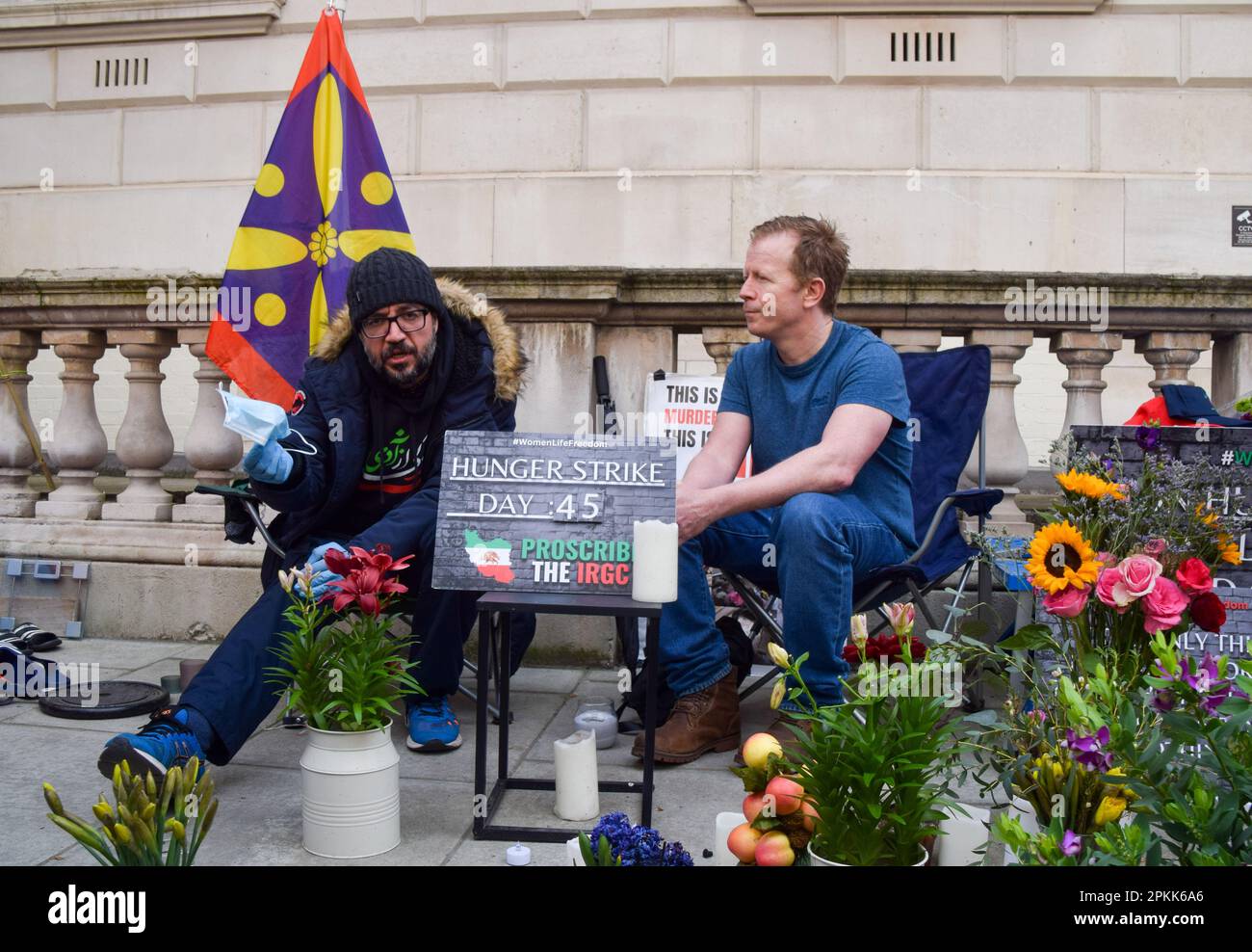 London, UK. 8th April 2023. Climate activist Angus Rose (R), who spent ...