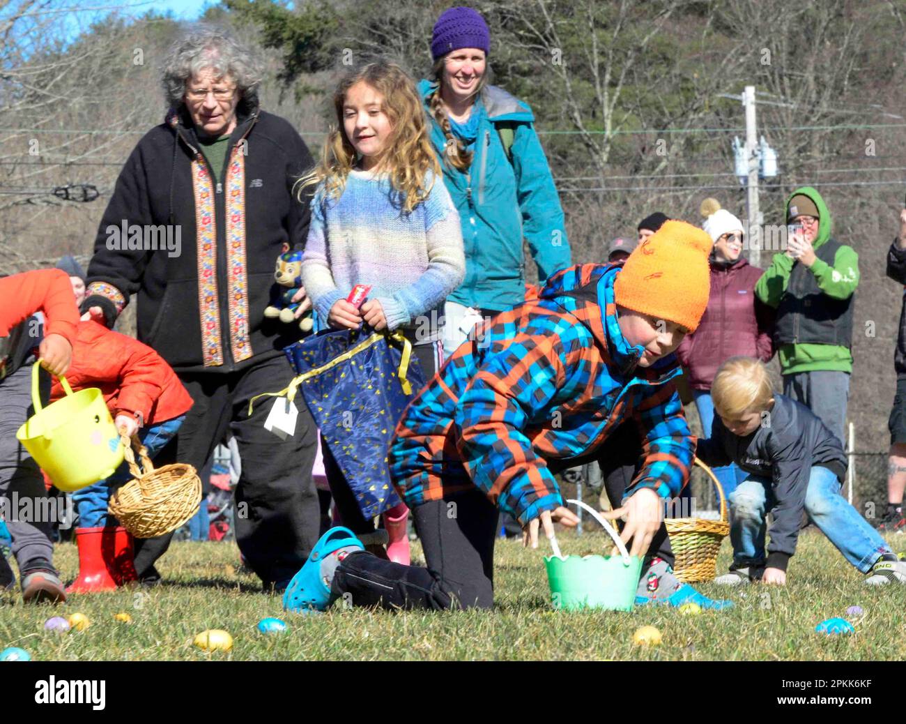 Cal Chapman, 8, of Brattleboro, collects Easter eggs during the annual ...