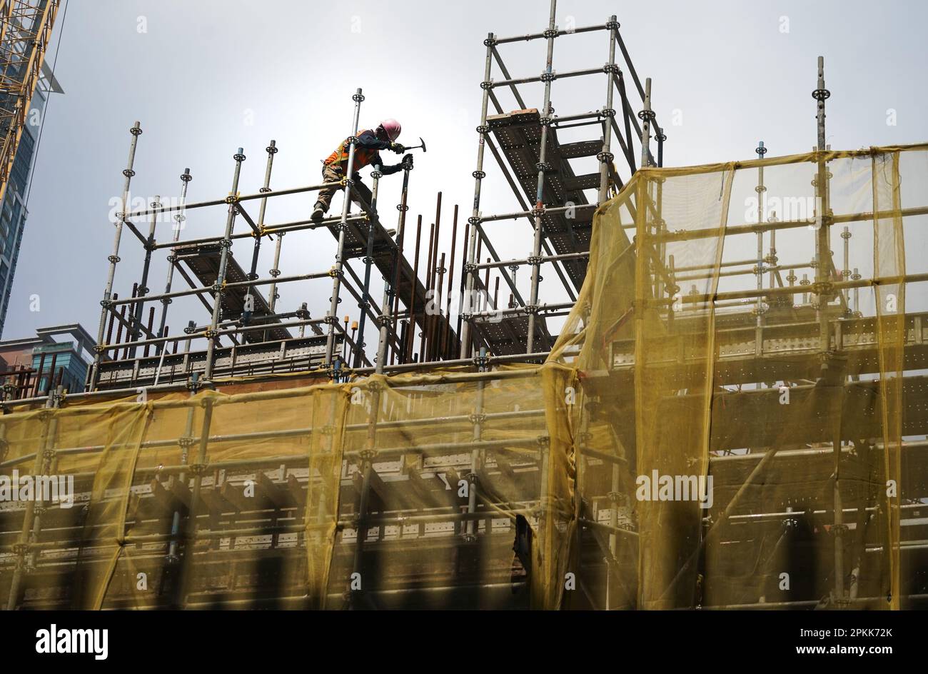 Workers in the construction site at West Kowloon under the high temperature. The Observatory ...