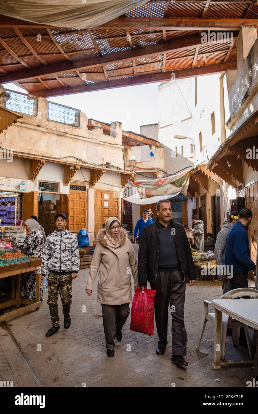 People wander through the alleys of Fez Medina in Morocco Stock Photo ...